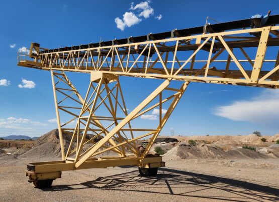 Radial Stacker - 24” wide x 100’ long Fixed Height Radial Conveyor ...